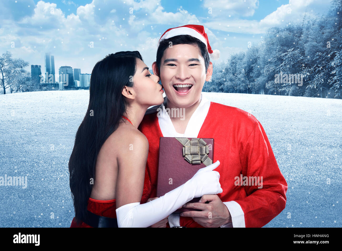 Santa woman give kiss to her lover. Christmas concept Stock Photo - Alamy