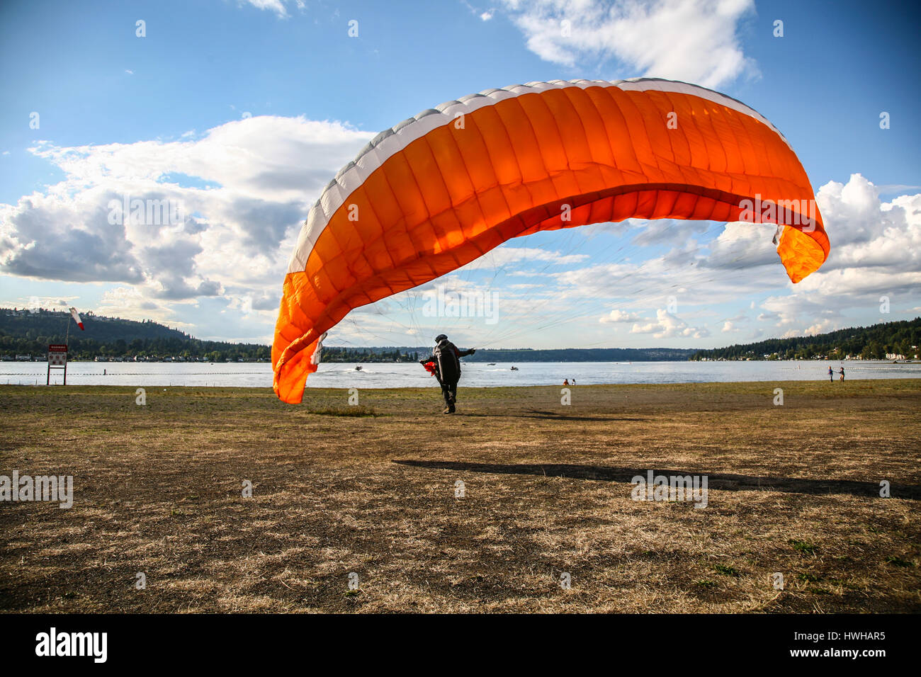 Paraglider taking off over lake hi-res stock photography and images - Alamy