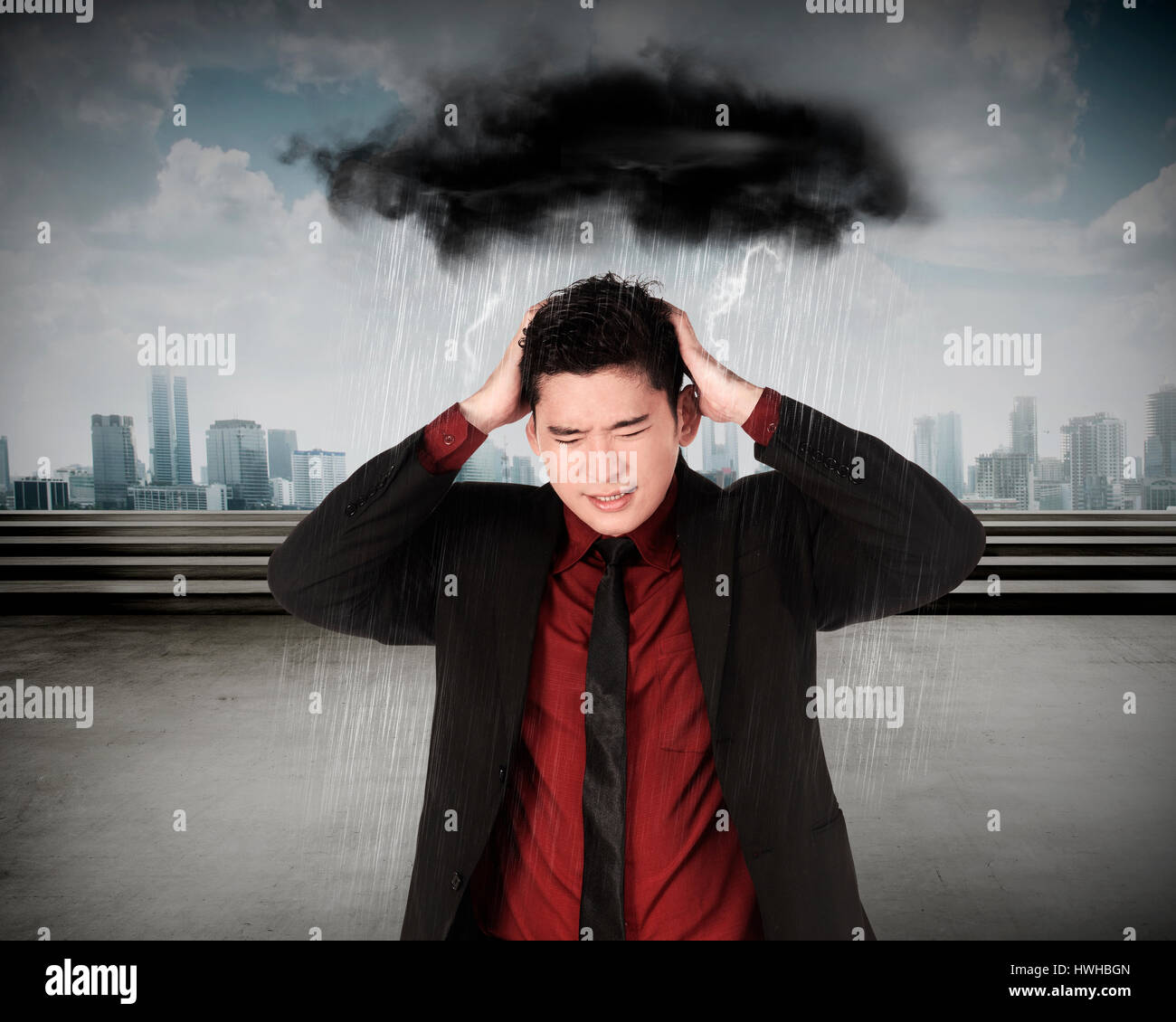 Young asian business man under rain covering head with hands Stock ...