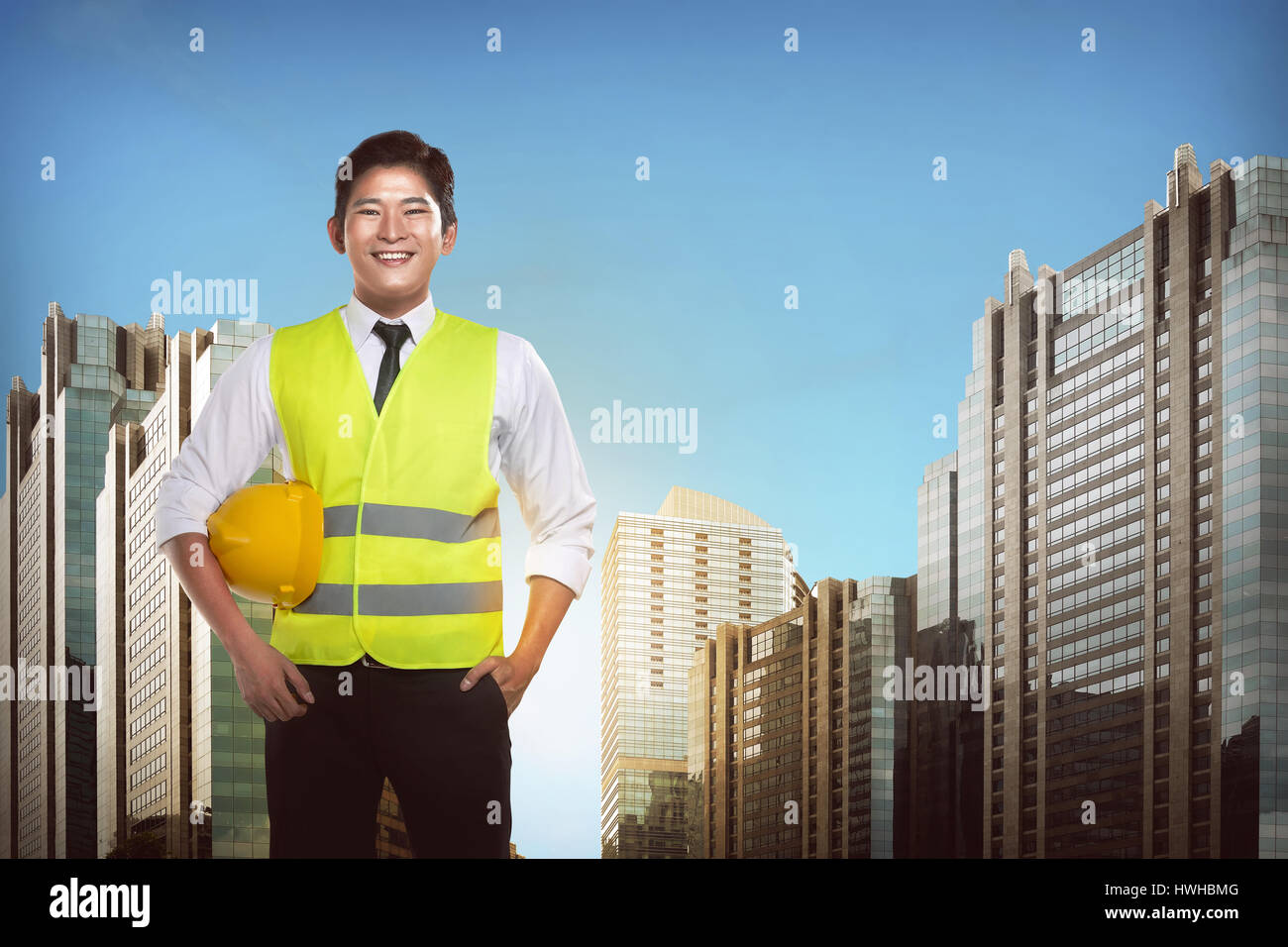 Asian engineer wearing safety vest. Industrial concept Stock Photo - Alamy