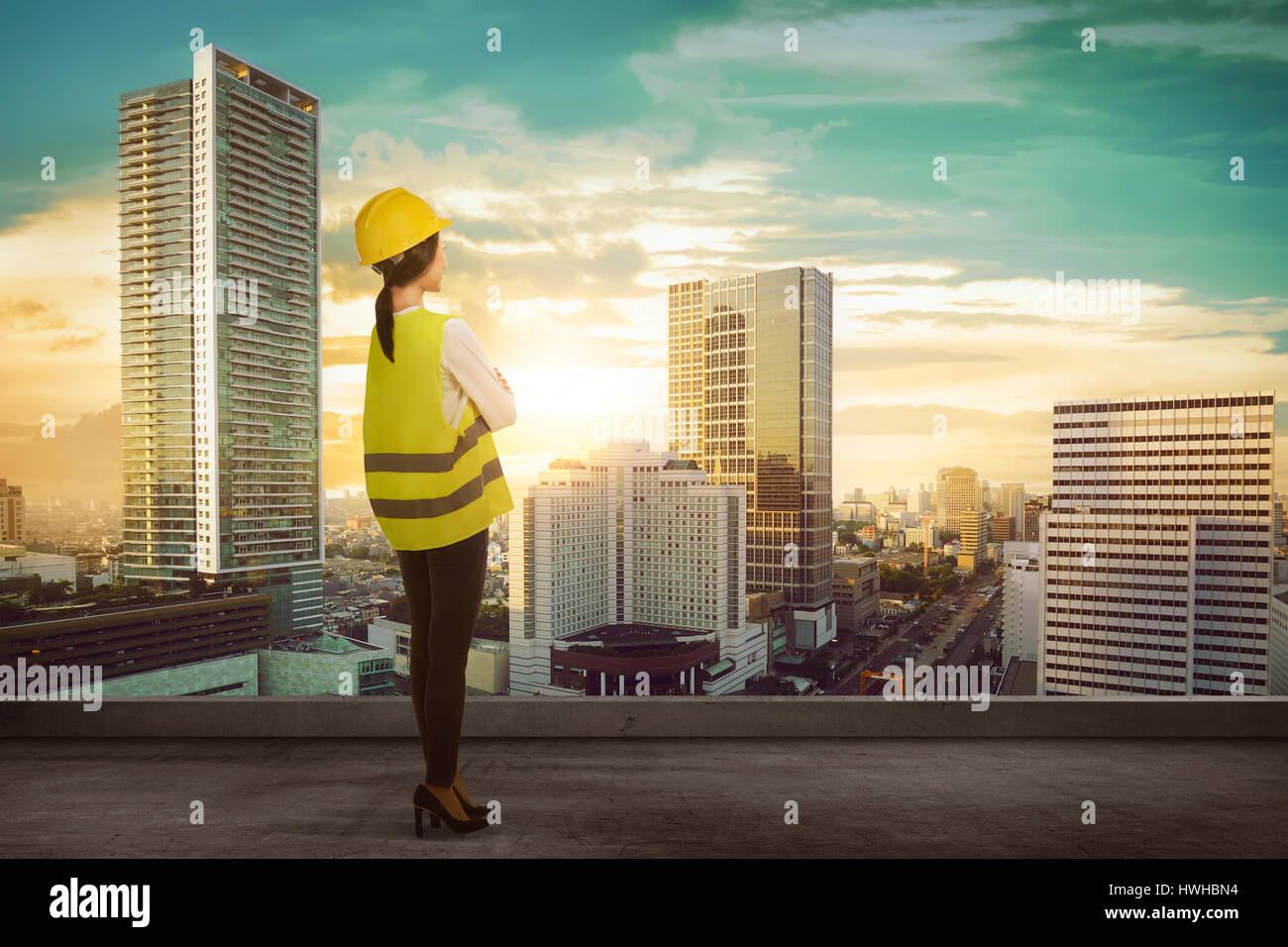Back view of asian architect looking at the city Stock Photo - Alamy