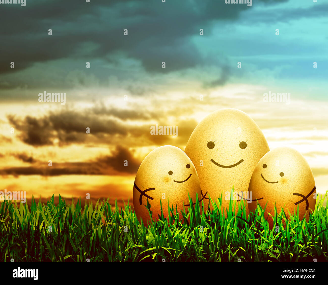 Three easter eggs with smile drawing put on the grass Stock Photo - Alamy