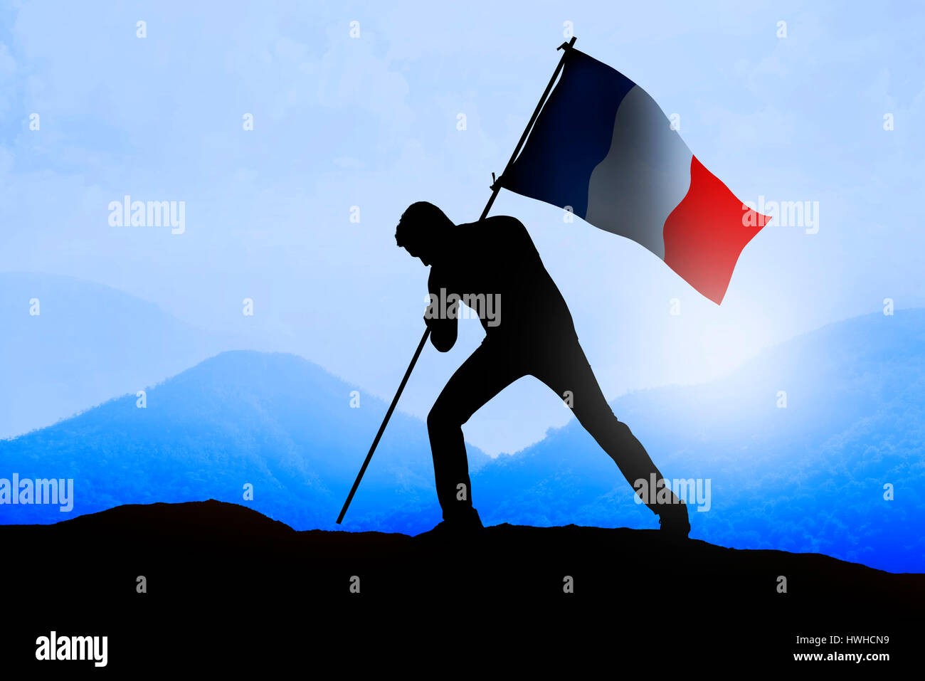 Silhouette of man holding france flag standing on the mountain Stock ...