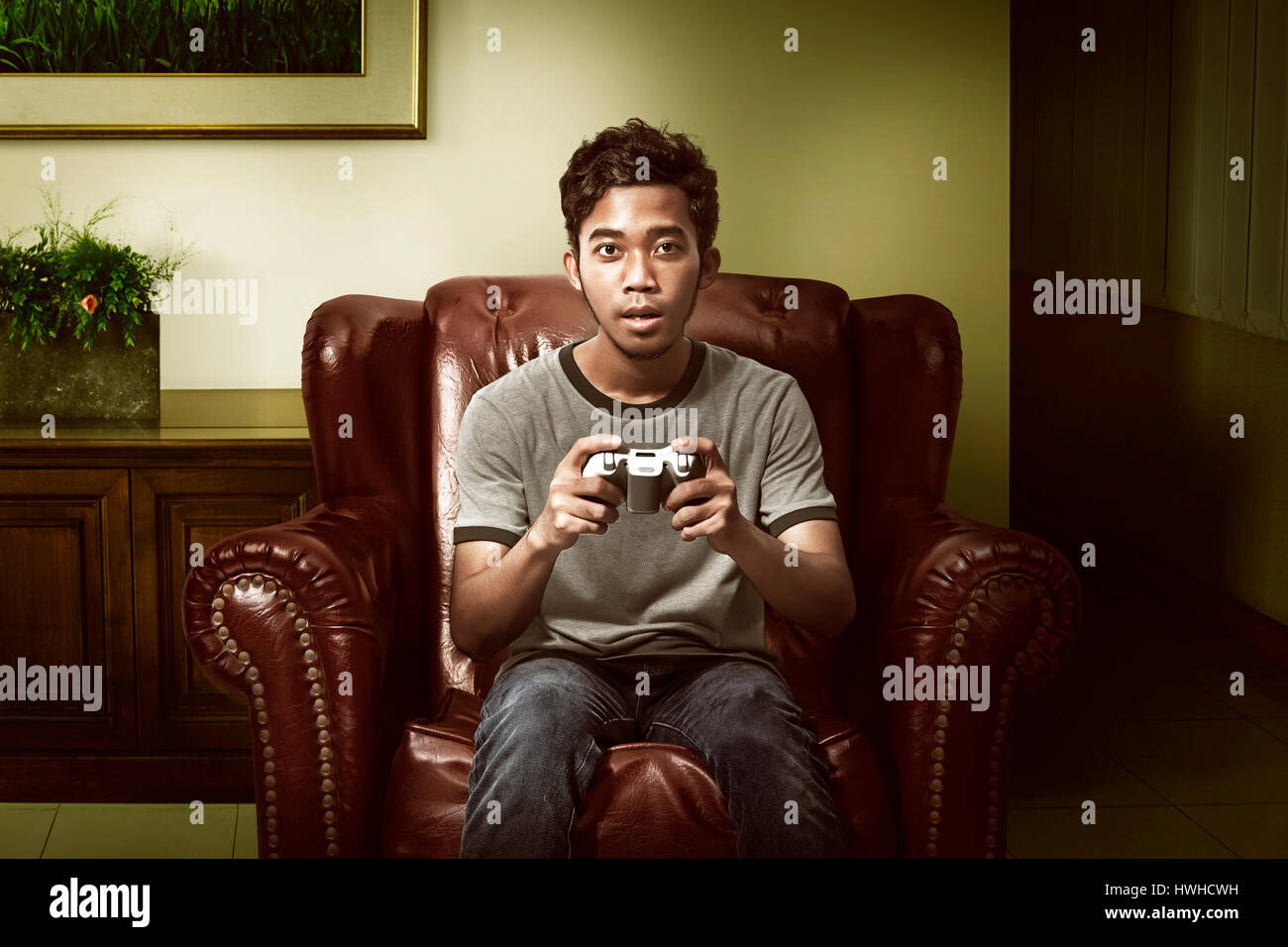 Asian gamer playing video games hi-res stock photography and images - Alamy