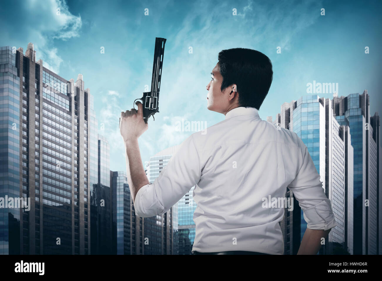 Secret agent holding gun ready to fire Stock Photo - Alamy
