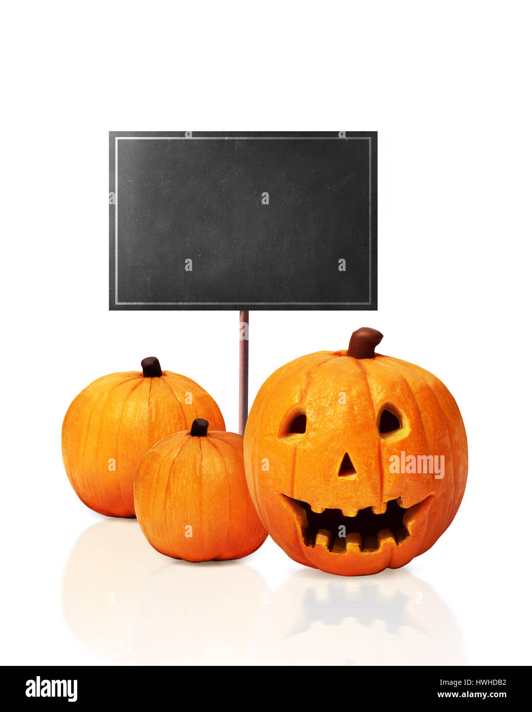 Three Jack O'Lantern and black board isolated over white background ...