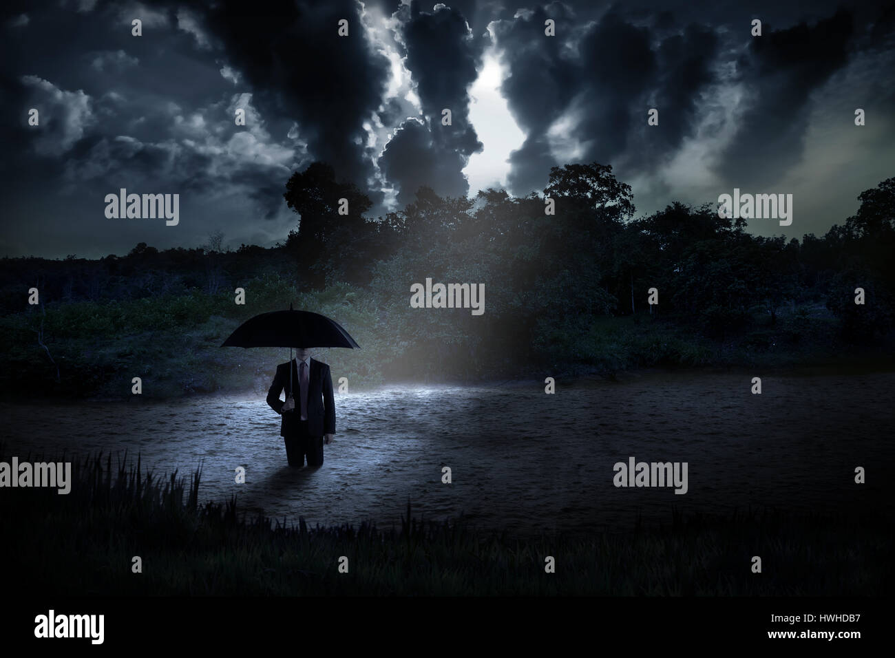 Spooky man standing on the creepy lake. Halloween concept Stock Photo ...