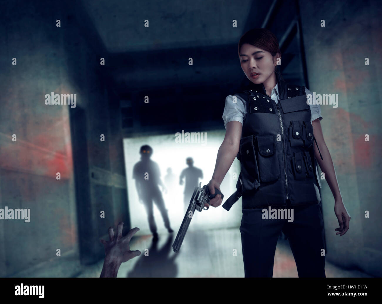Brave woman with shoot the zombies on inside building Stock Photo - Alamy