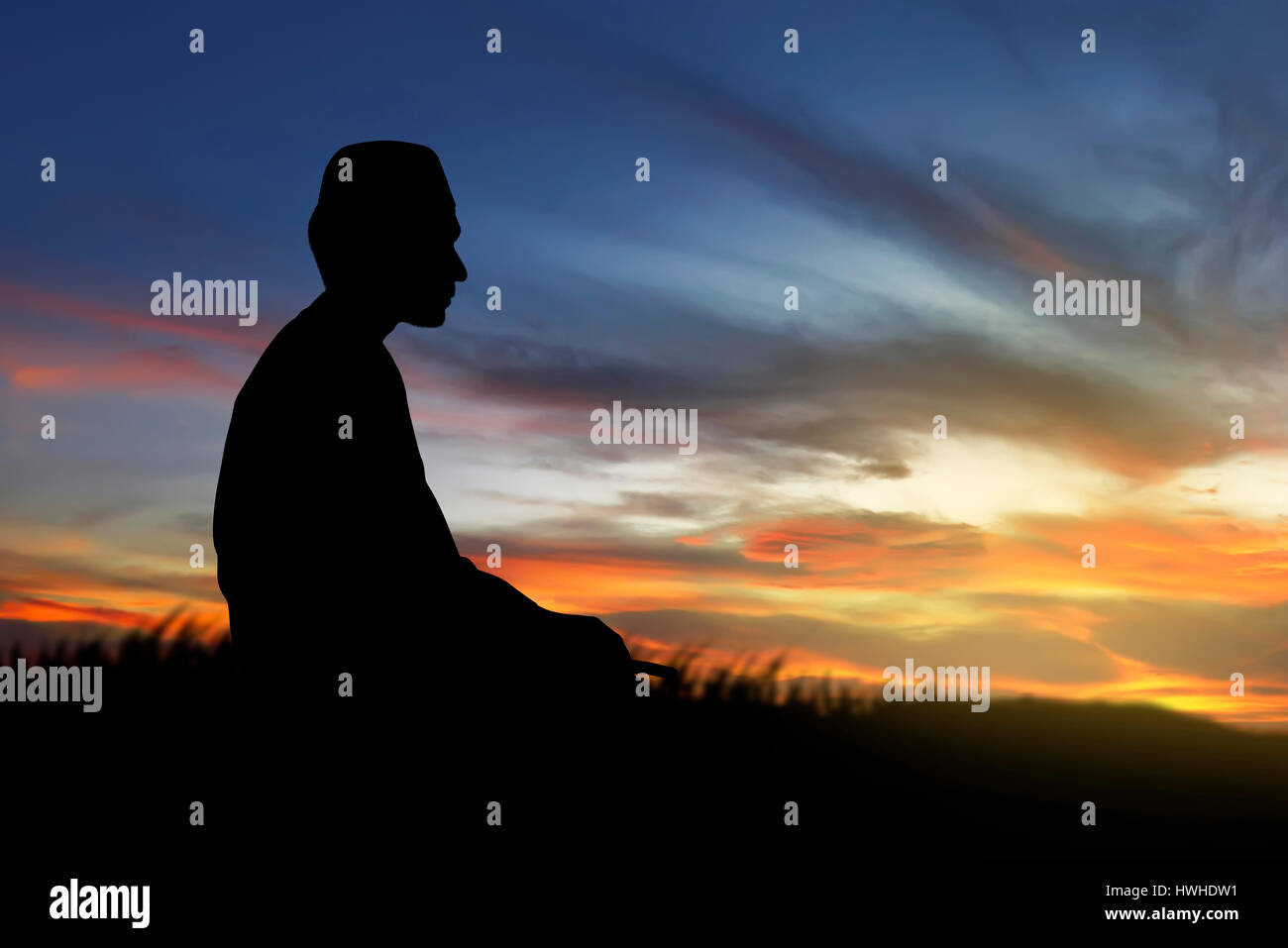 Image of silhouette man praying with sunset background Stock Photo - Alamy