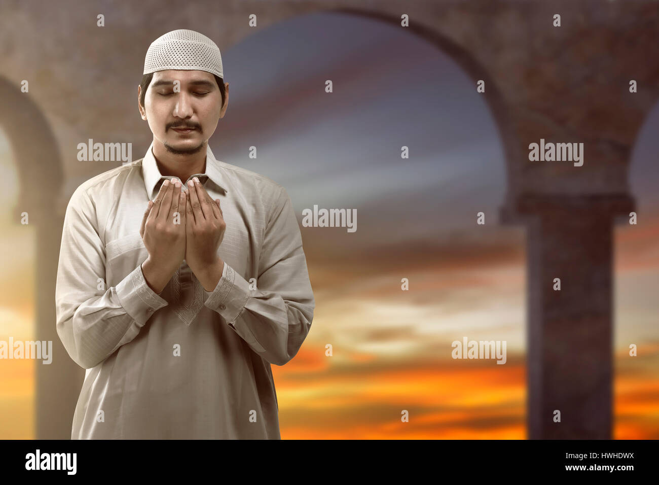 Image of young muslim man praying. Islamic conceptual Stock Photo - Alamy
