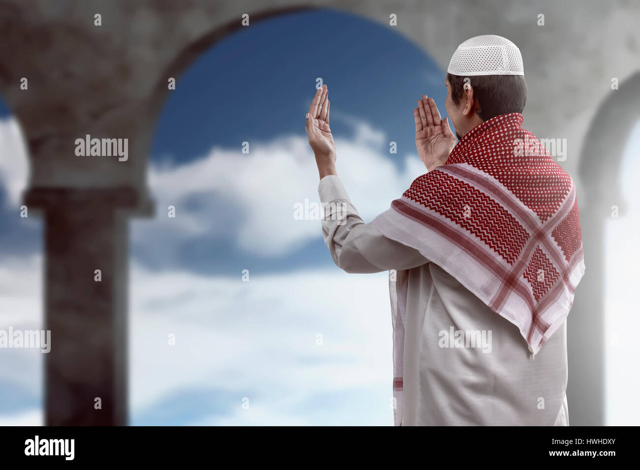 Back view of young muslim man praying Stock Photo - Alamy
