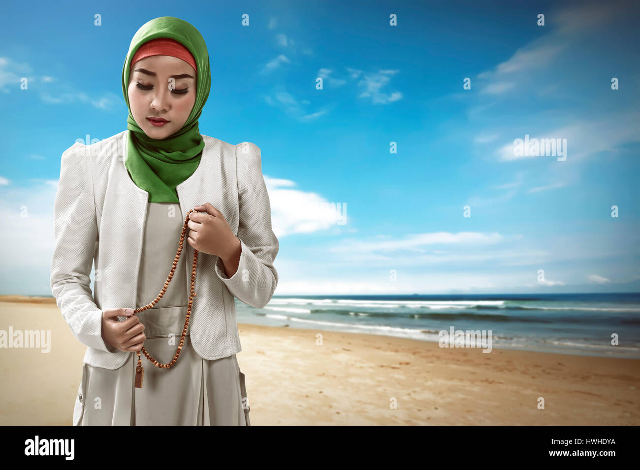 Woman praying beach hi-res stock photography and images - Alamy