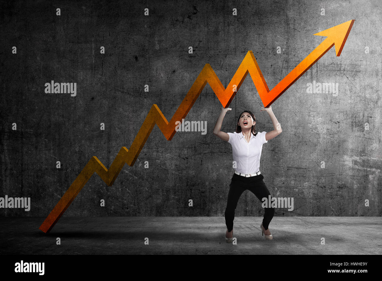 Asian business woman raise up sales chart so its ascending Stock Photo ...