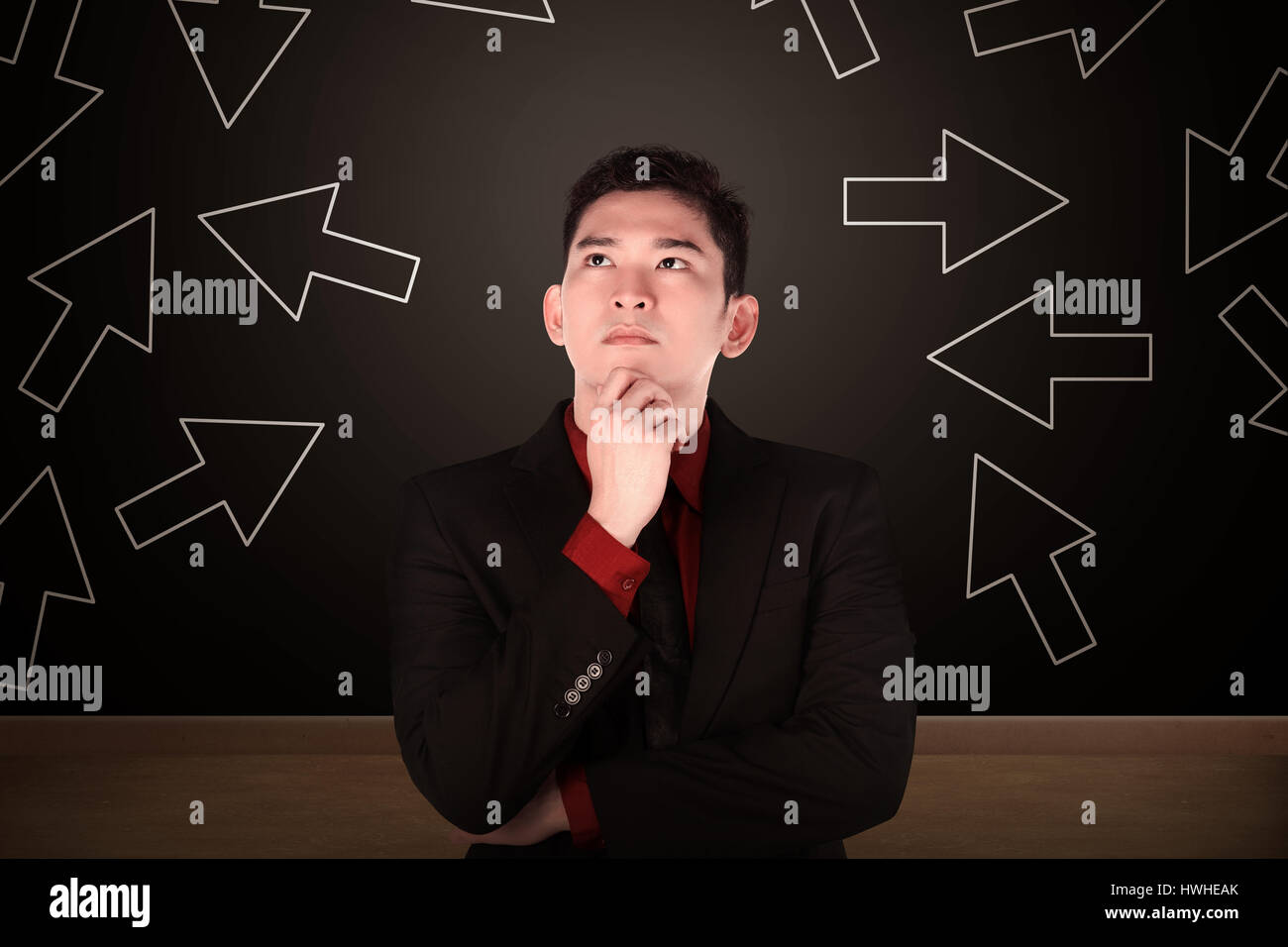 Business man think with arrow shape on the background Stock Photo - Alamy