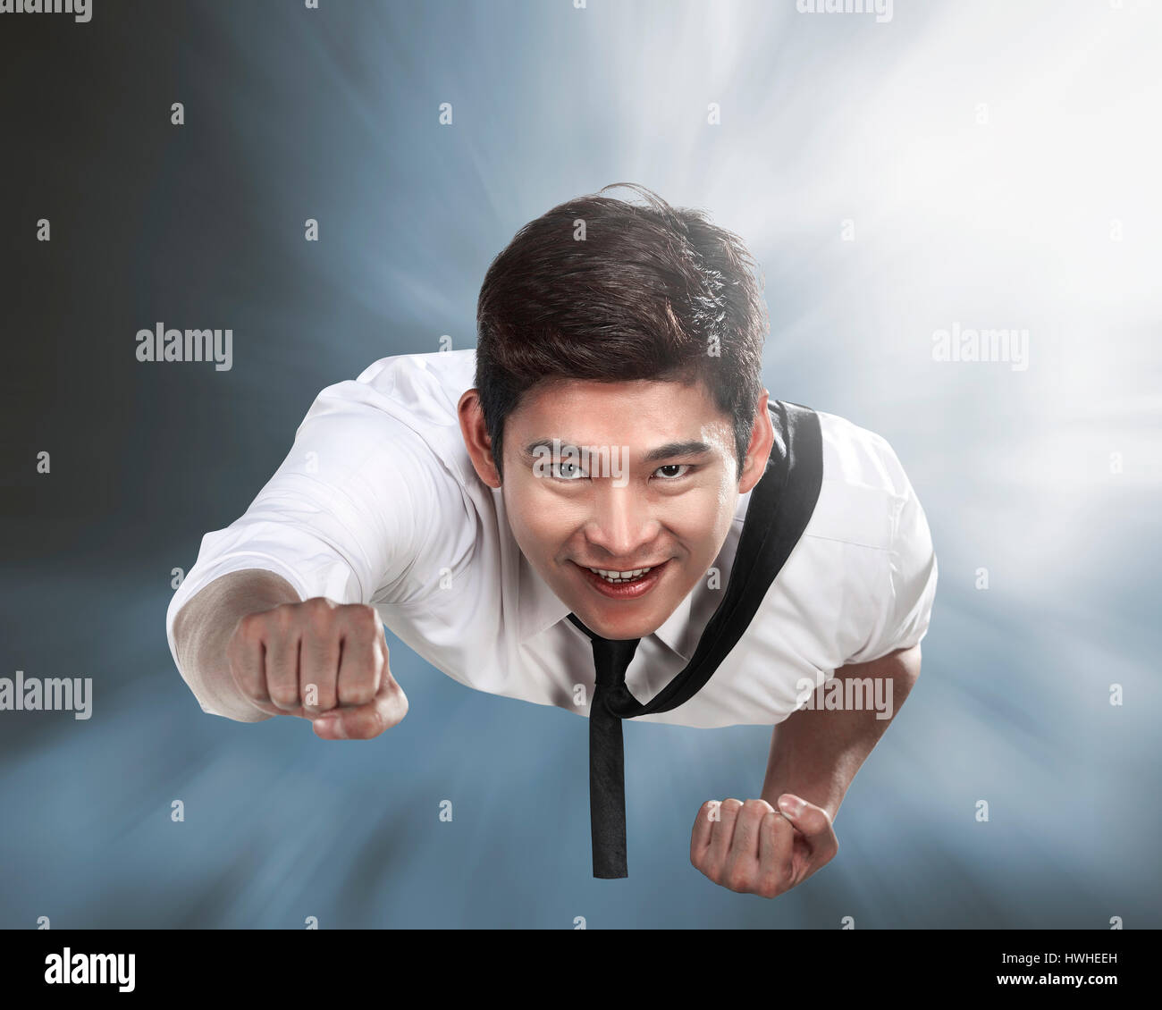 Handsome young asian business man flying through the sky Stock Photo ...