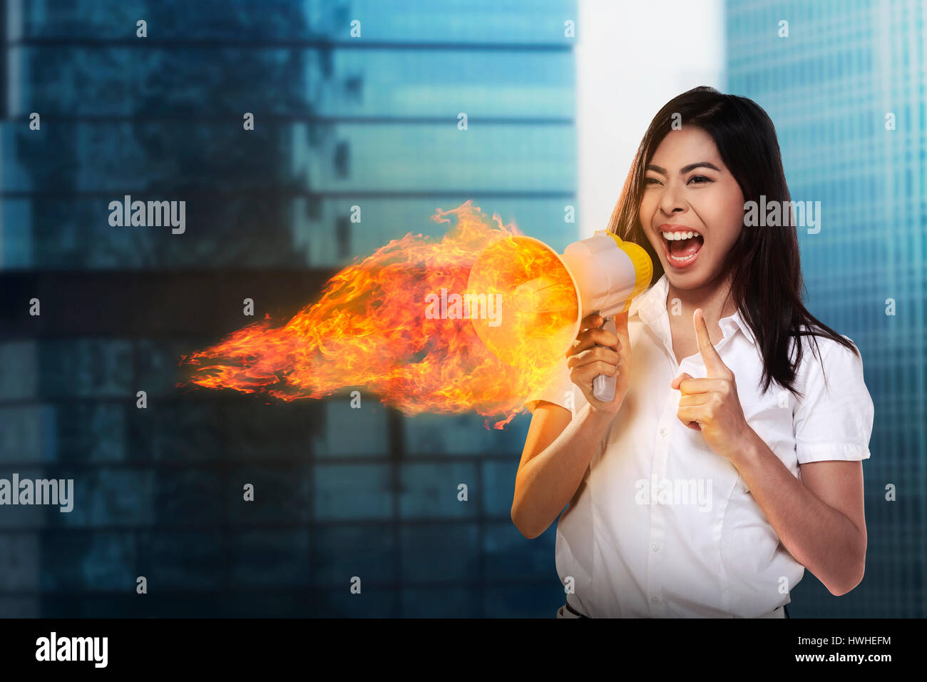 Asian business woman with a megaphone shouting megaphone on fire Stock ...