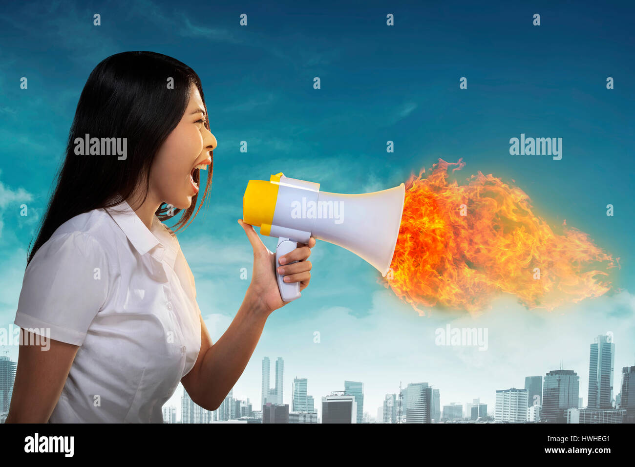 Asian business woman with a megaphone shouting megaphone on fire Stock ...