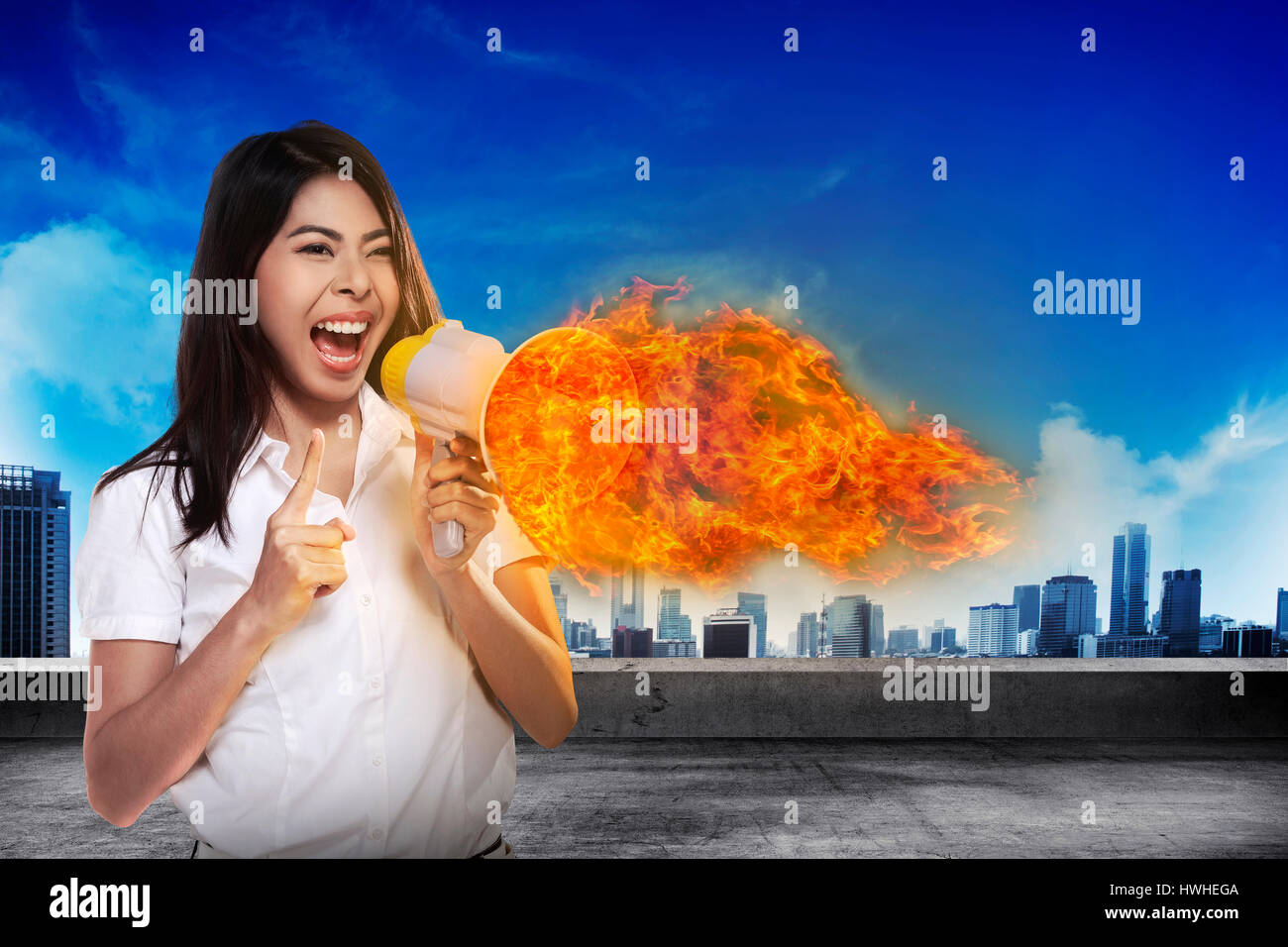Asian business woman with a megaphone shouting megaphone on fire Stock ...