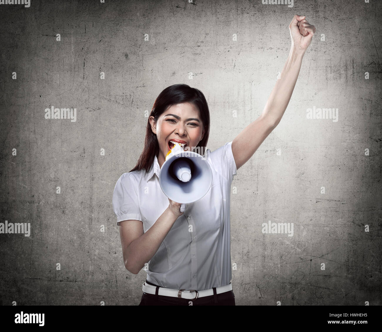 Asian business woman talk loud using megaphone Stock Photo - Alamy