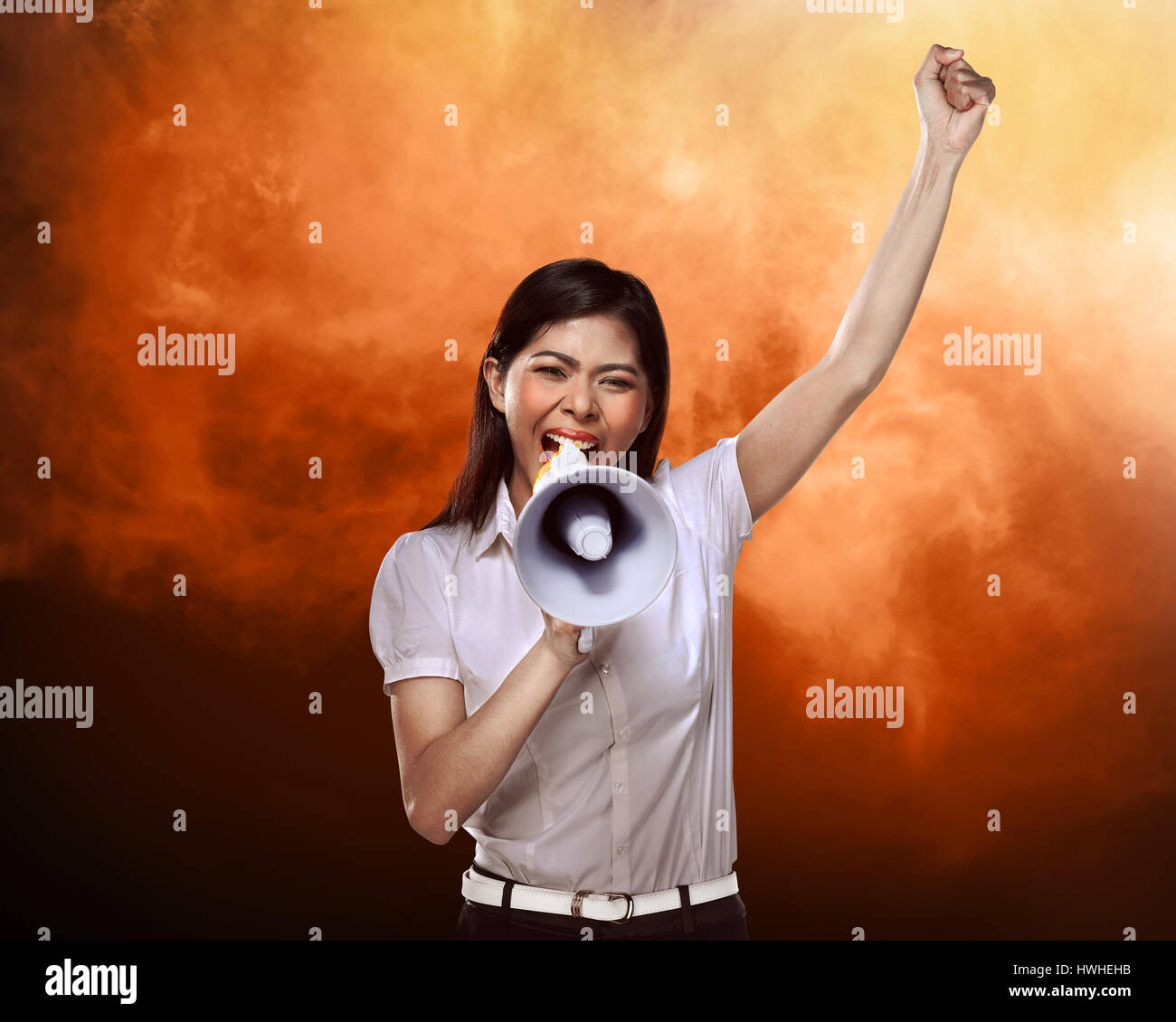 Asian business woman talk loud using megaphone Stock Photo - Alamy