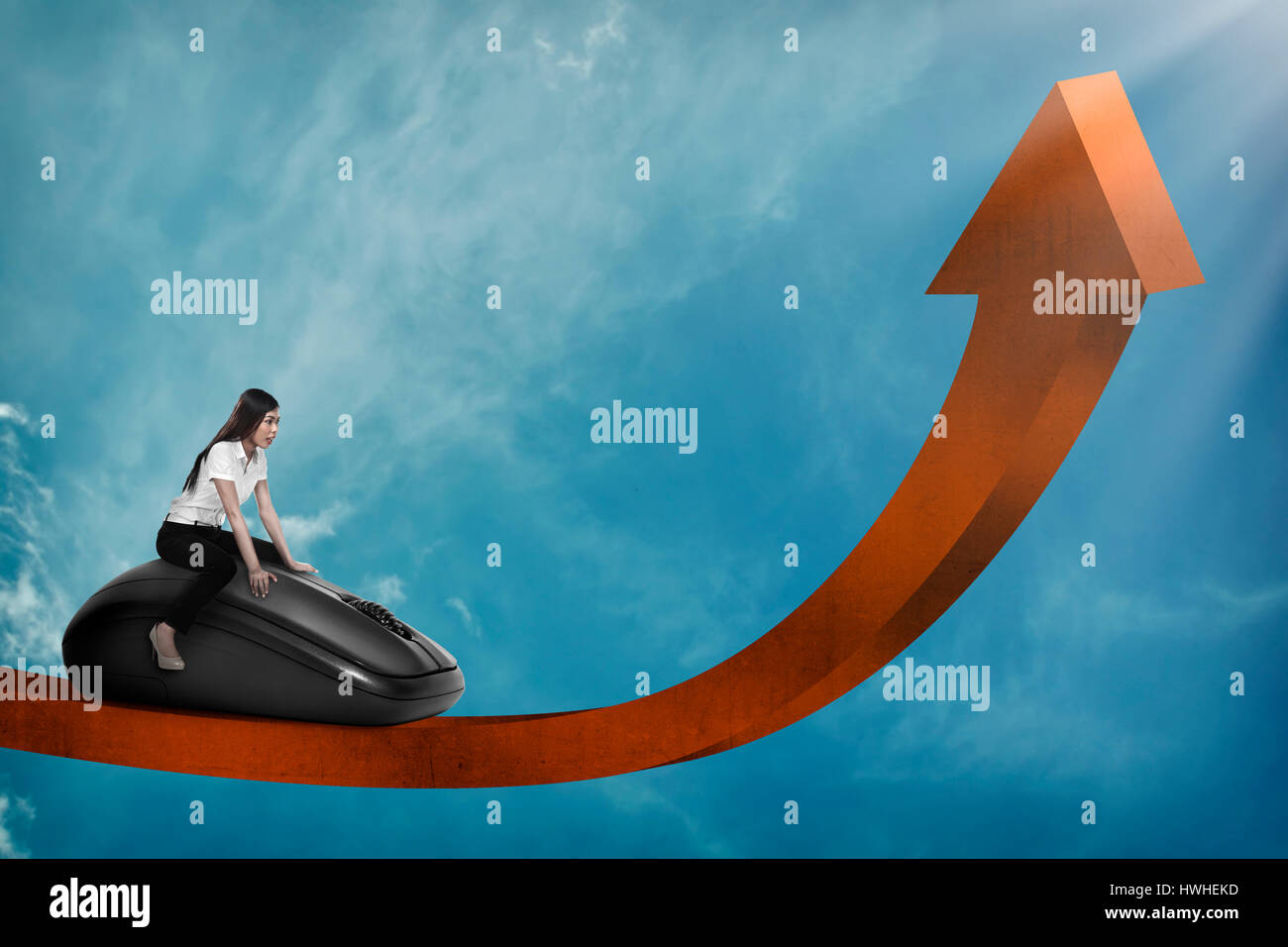 Asian business person riding computer mouse. Business technology ...