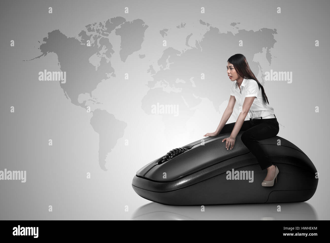 Asian business person riding computer mouse. Business technology ...