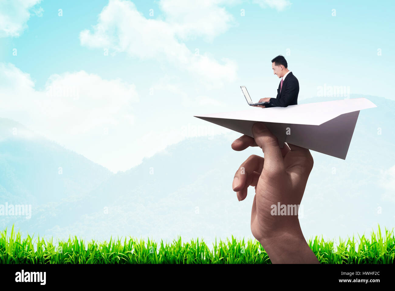 Business man typing with laptop on the paper plane ready to fly Stock ...