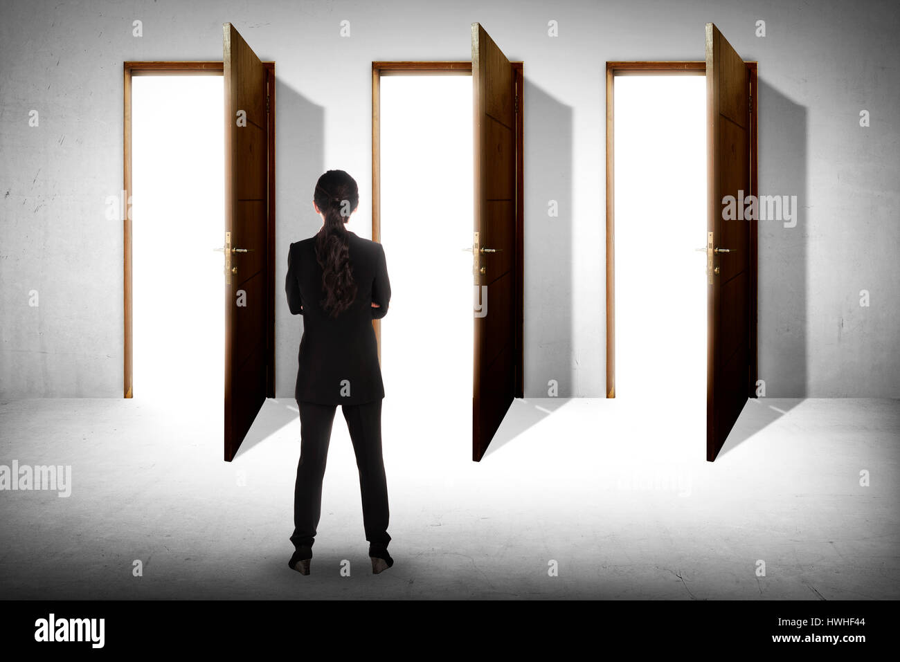 Asian business woman has to choose between three options Stock Photo ...