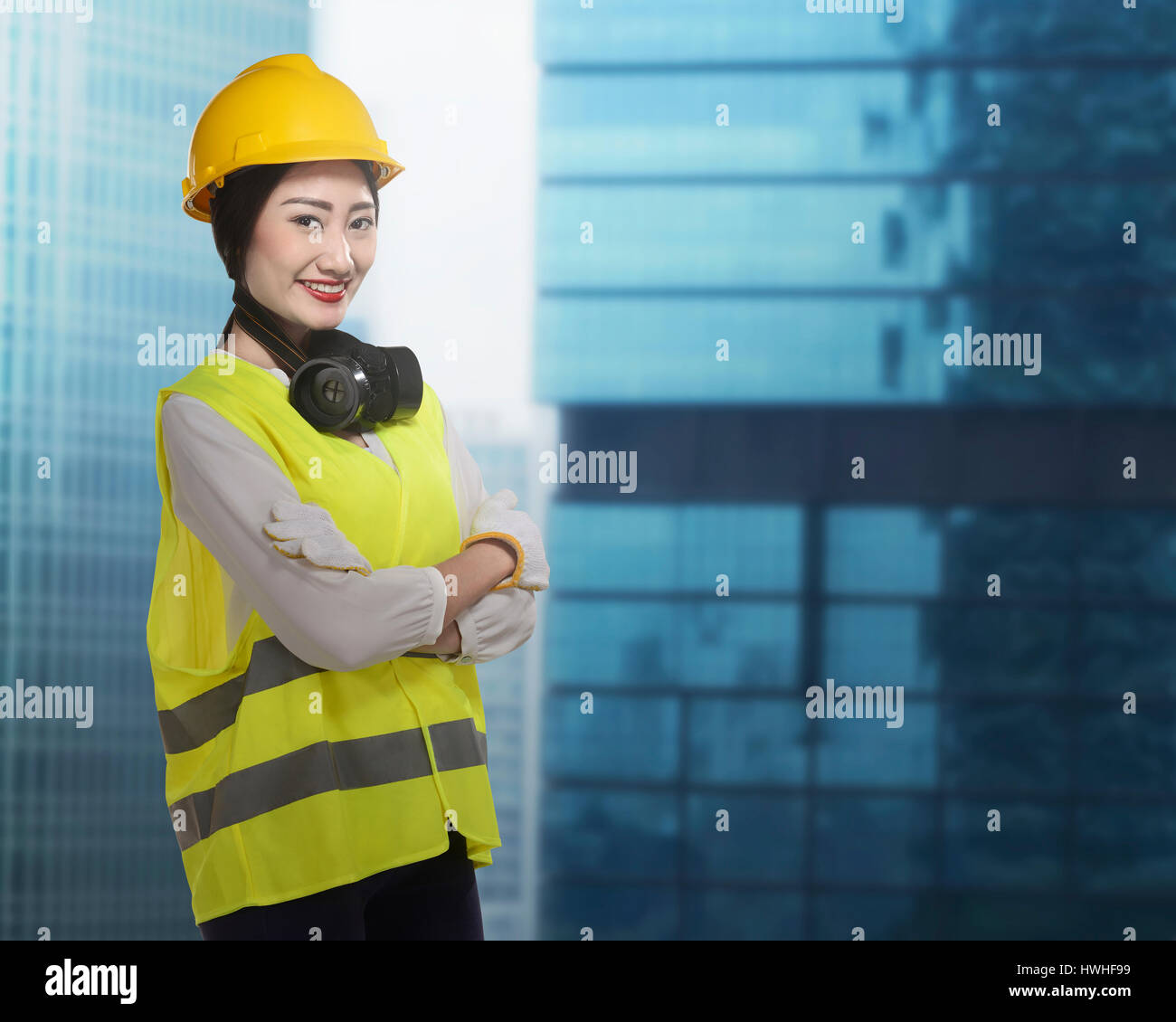 Asian business woman smiling over office building background Stock ... Asian business woman smiling over office building background Stock ...