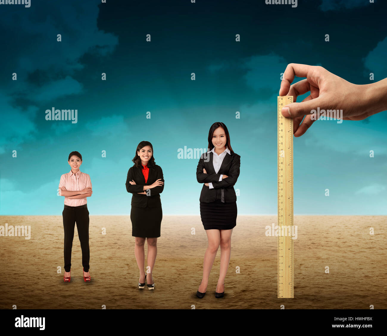 Hand holding wooden ruler, mesuring employee performance. Working ...