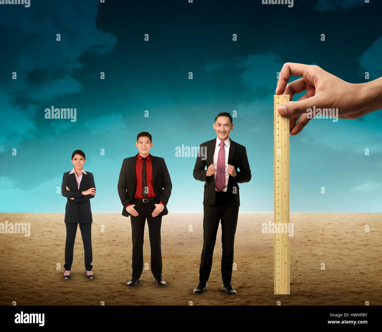 Hand holding wooden ruler, mesuring employee performance. Working ...