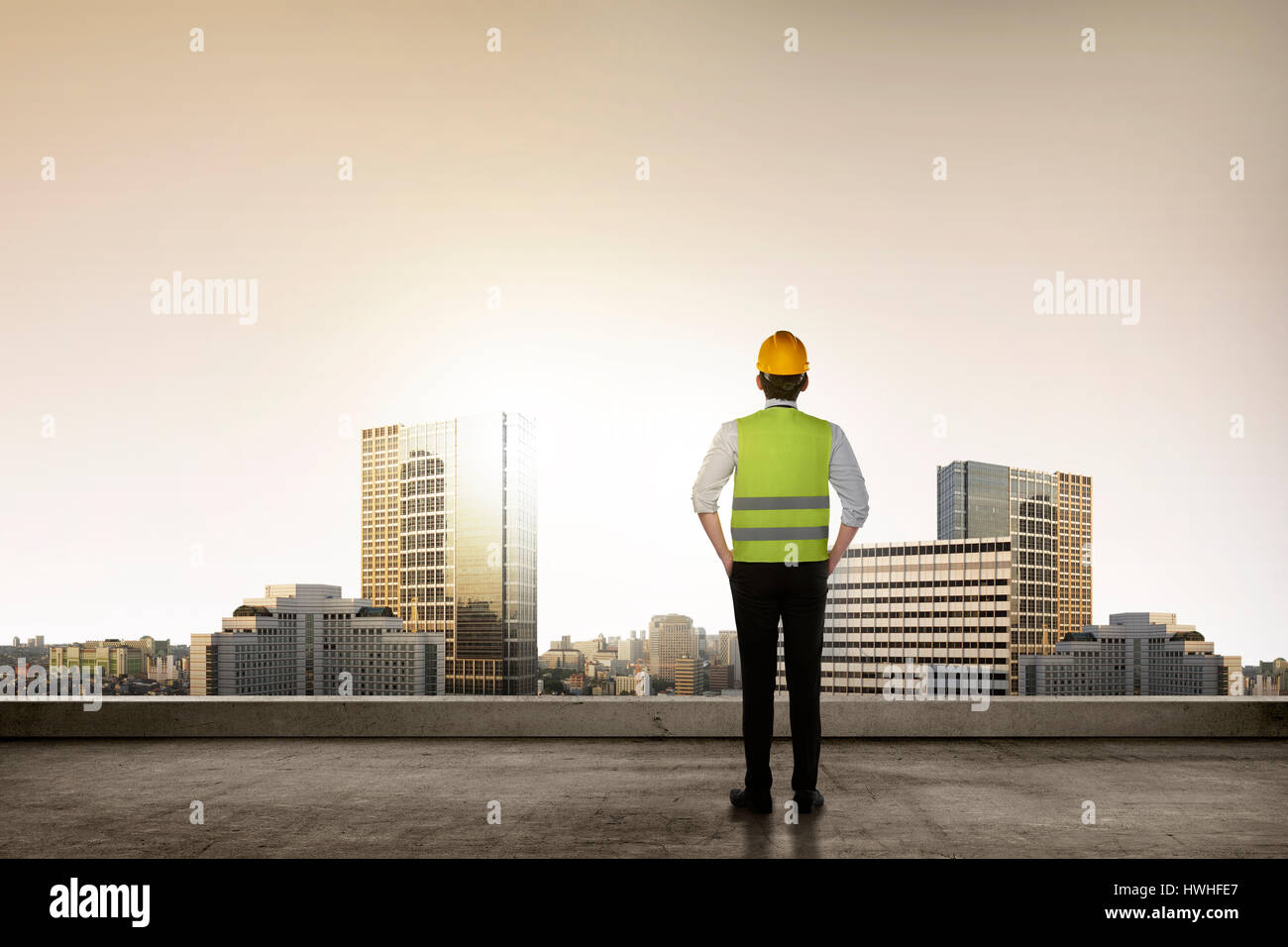 Back view of young succesful asian architect over city background Stock ...