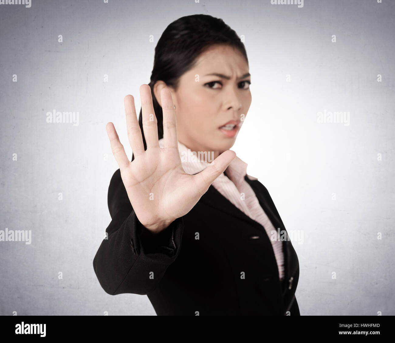 Business woman say no, with grunge wall background Stock Photo - Alamy