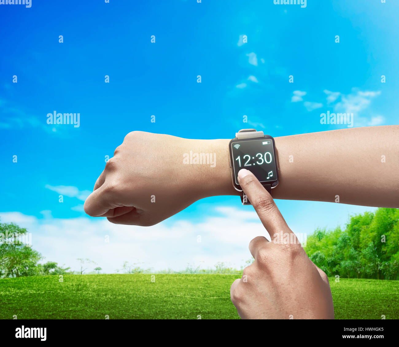 Hand setting time on smartwatch. Gadget technology concept Stock Photo ...