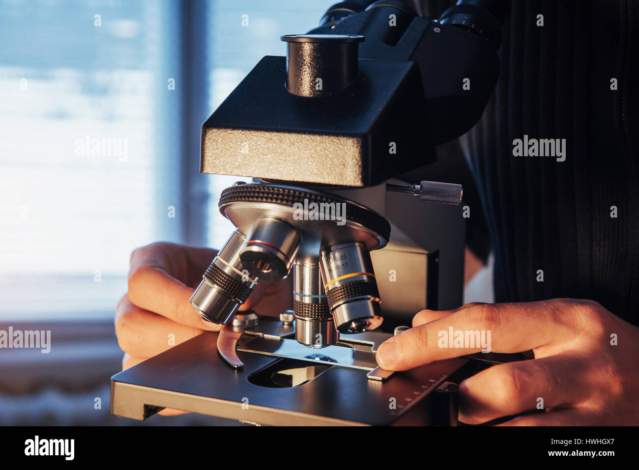 close-up of scientist hands with microscope, examining samples Stock ...