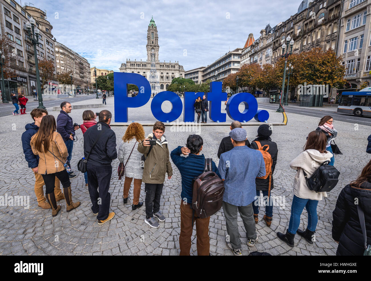 Tourists takes photos of Porto sign at Avenue of the Allies (Avenida ...