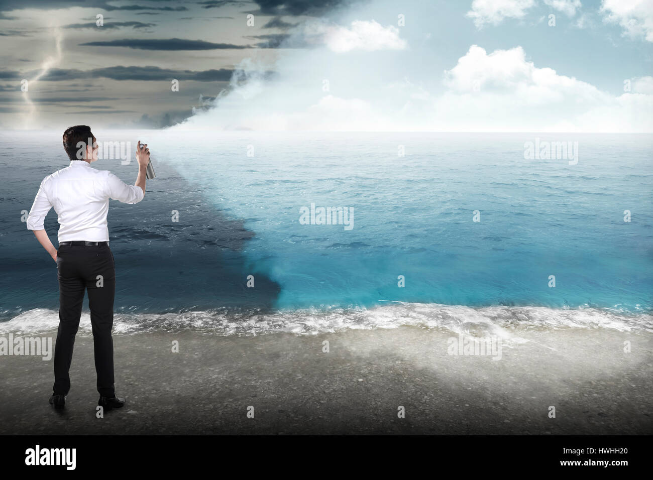 Asian business person spraying hi-res stock photography and images - Alamy