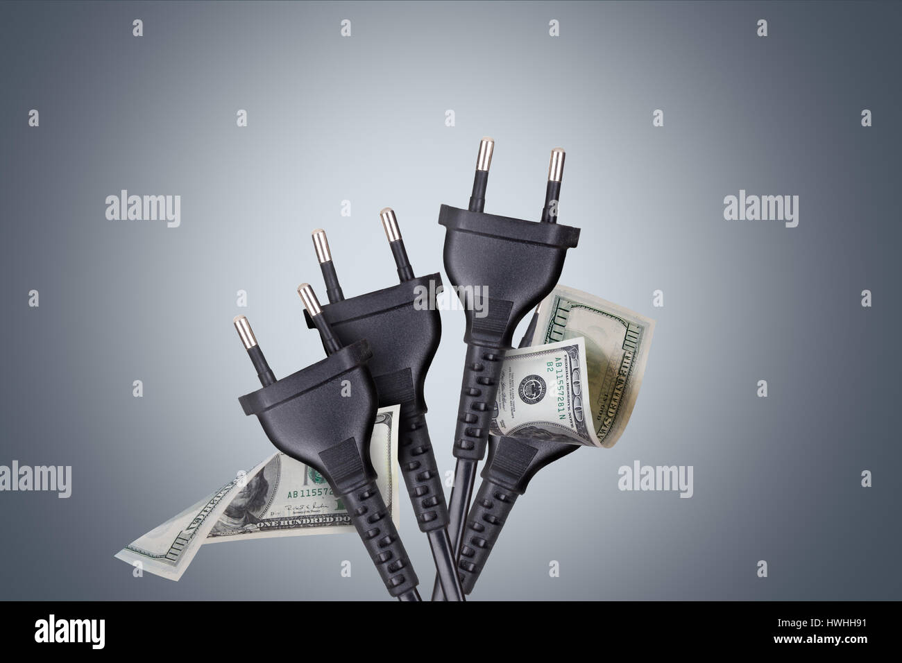 Close up detailed view of black plugs with dollar banknotes around, on ...