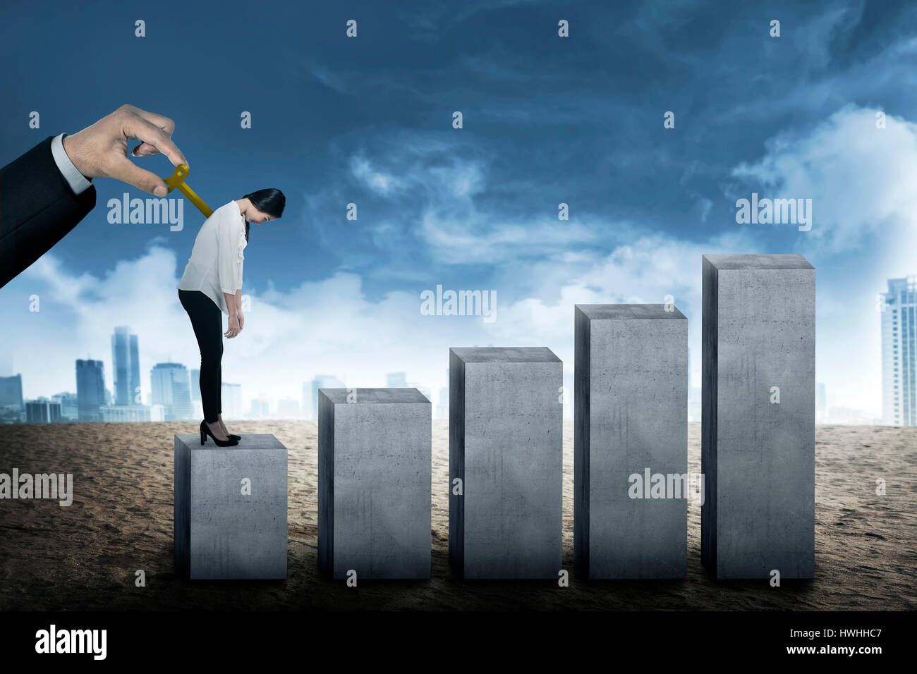 Hand turns clockwork on the back of business person, concept to control ...