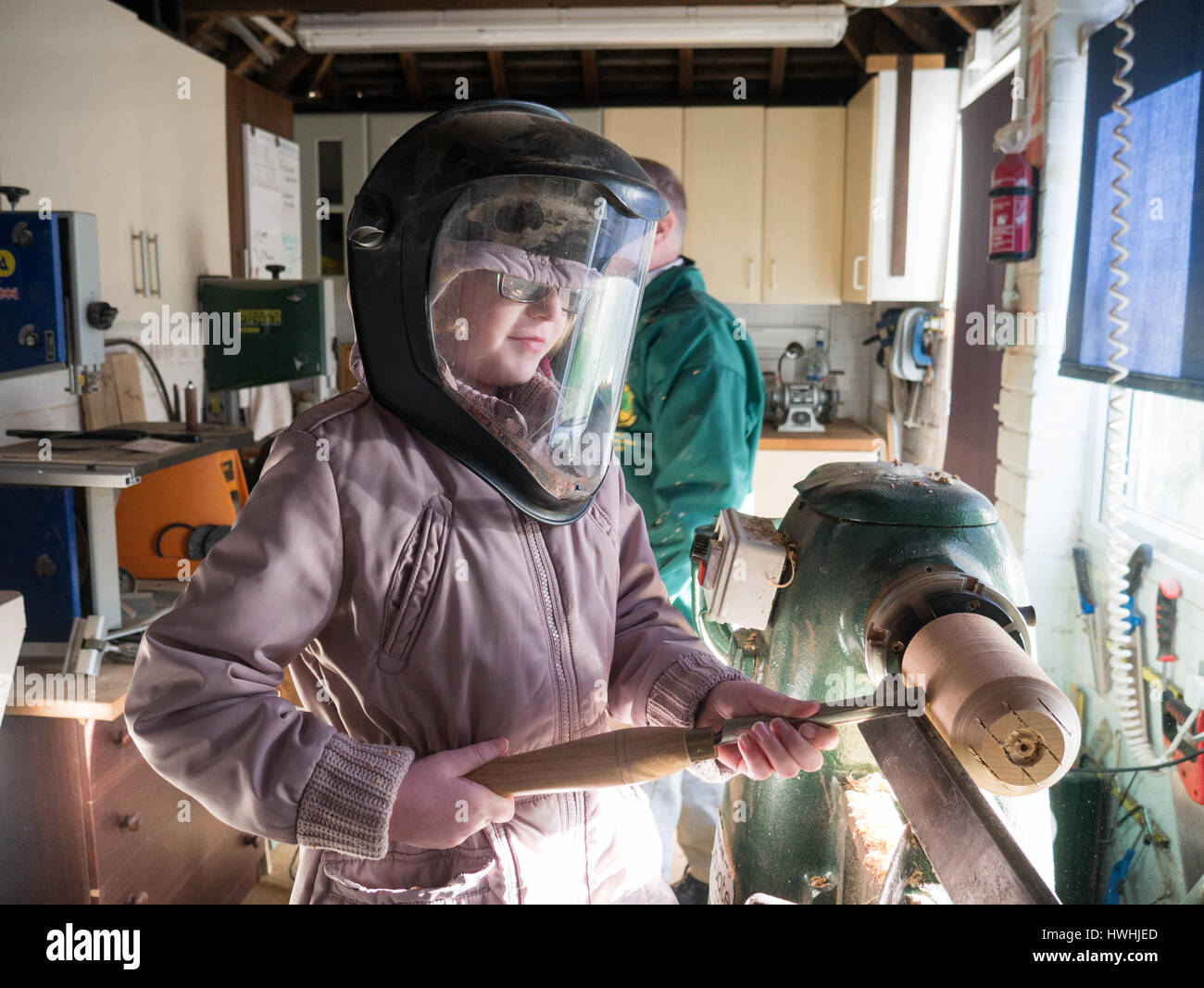 Young girl operating lathe Stock Photo - Alamy