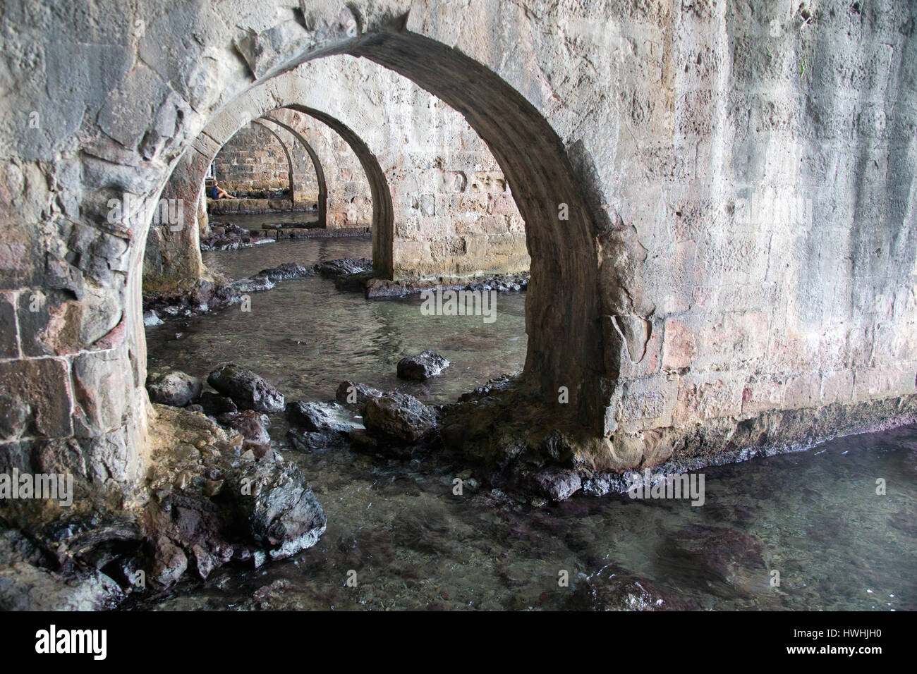 Arches inside shipyard of Alanya medieval castle Stock Photo - Alamy