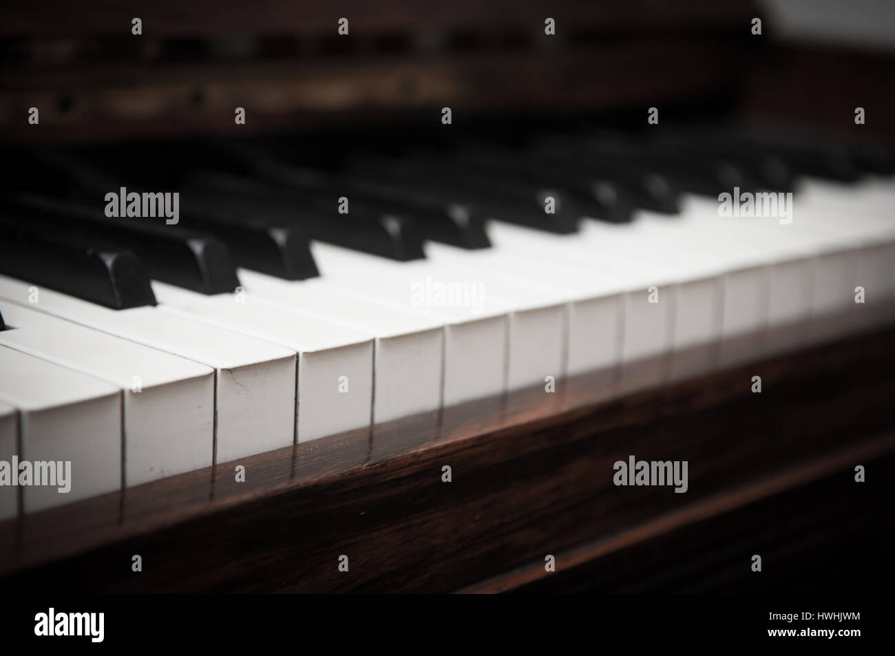 Vintage piano keys on an old wooden piano Stock Photo - Alamy
