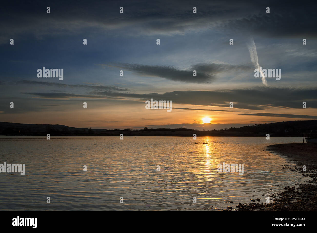 sunset on the lake as a backdrop in summer Stock Photo - Alamy