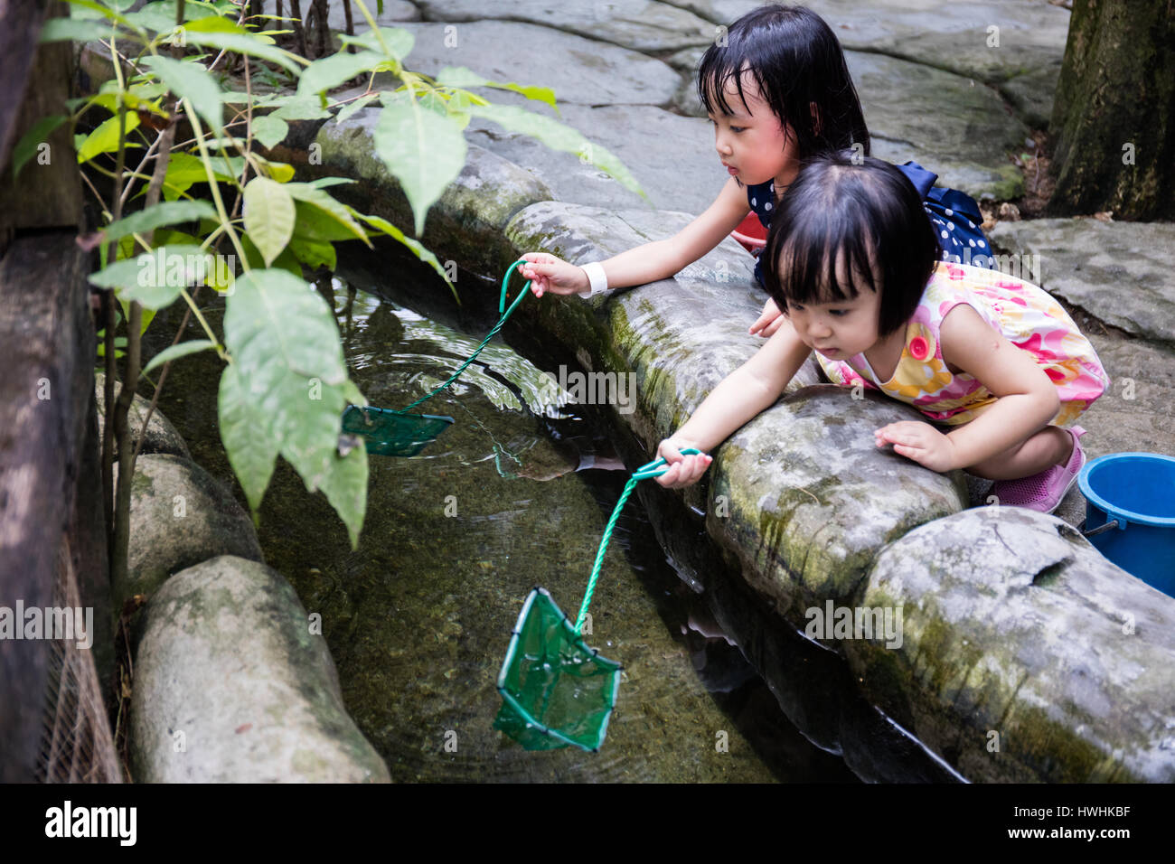 Asian children playing water outdoor hi-res stock photography and ...