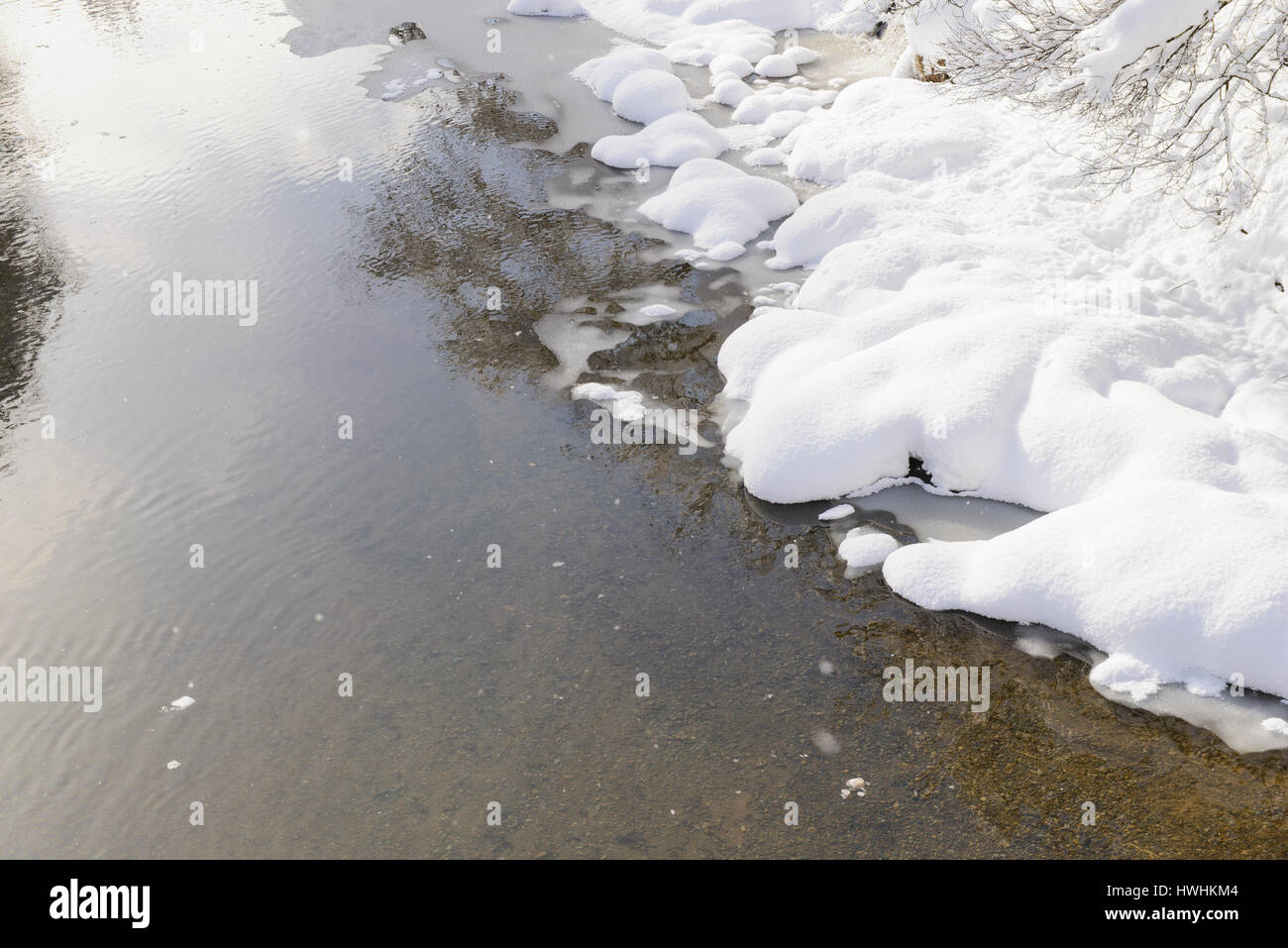 Stones snow in water hi-res stock photography and images - Alamy