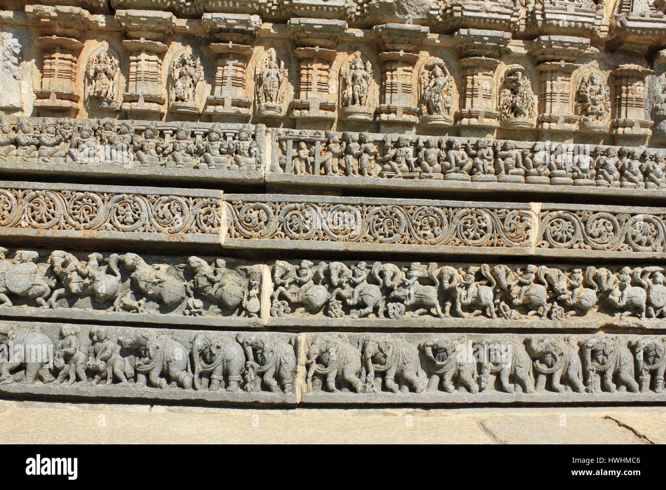 Stone carvings on the shrine wall at Chennakesava Temple, Hoysala ...