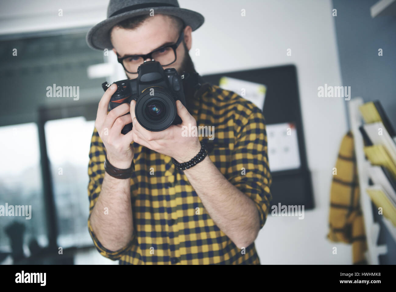 Male photographer editing images on camera Stock Photo - Alamy