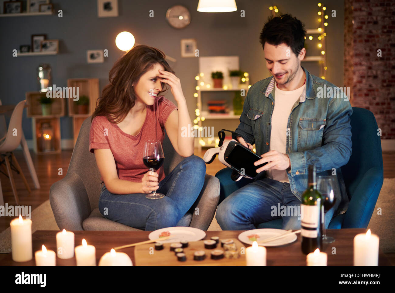 Couple having evening entertainment together Stock Photo - Alamy