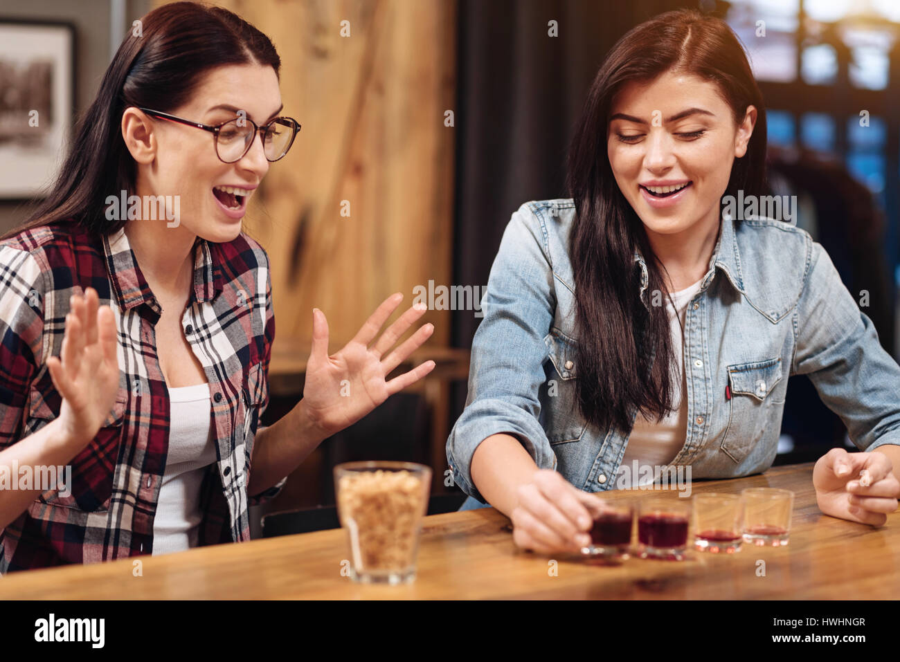 Give me please. Delighted brunette with glasses on her nose wearing ...