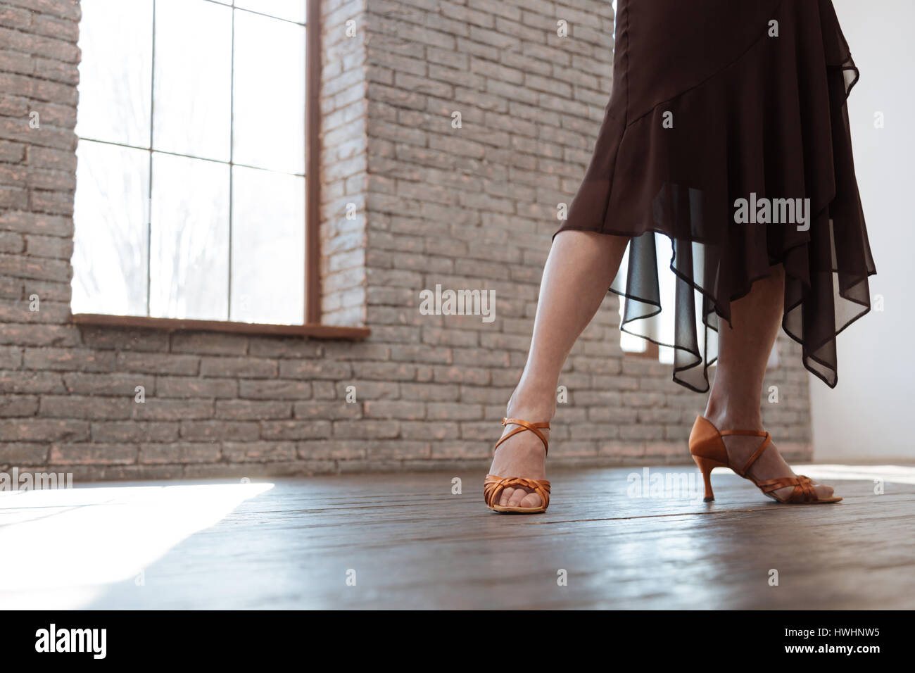 Step by step. Confident gifted aging woman dancing in the ballroom ...